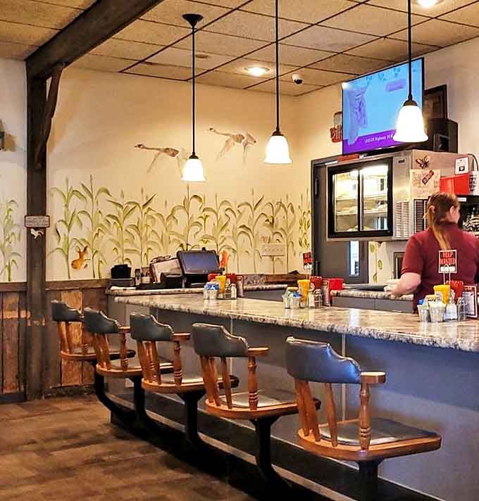 Counter seating with a view of both the kitchen action and hand-painted murals. Front-row seats to breakfast theater!