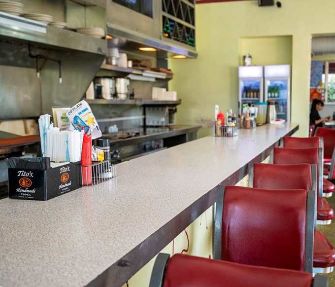 The classic diner counter offers front-row seats to the kitchen action, where Howley's "cooked in sight, must be right" philosophy comes alive.