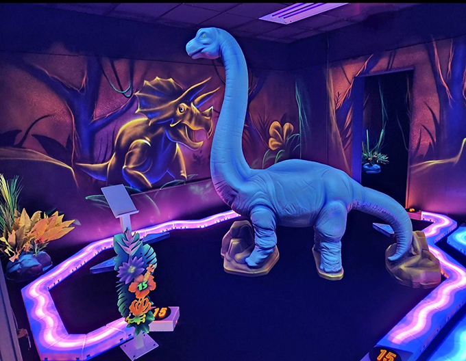 This gentle giant watches over putters with prehistoric patience, its blue silhouette creating a Jurassic backdrop for your putting adventures.