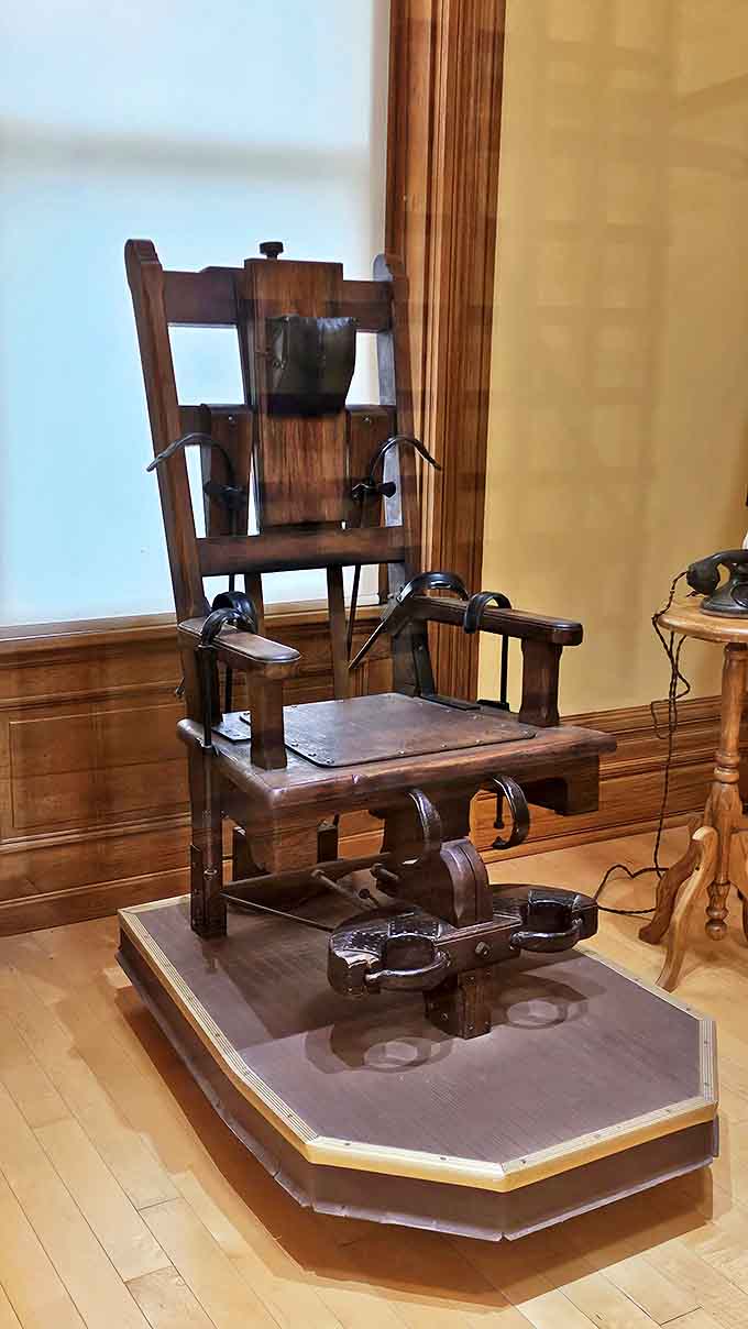 Shocking history: The electric chair stands as a grim reminder that some punishments are permanent. The wood grain has absorbed decades of fear.