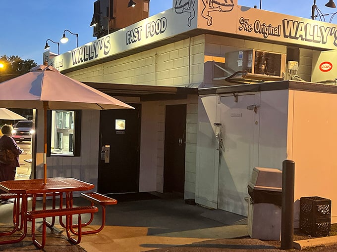 Dusk settles over Wally's Drive-In, but the glow of the sign promises burger satisfaction well into the evening hours.