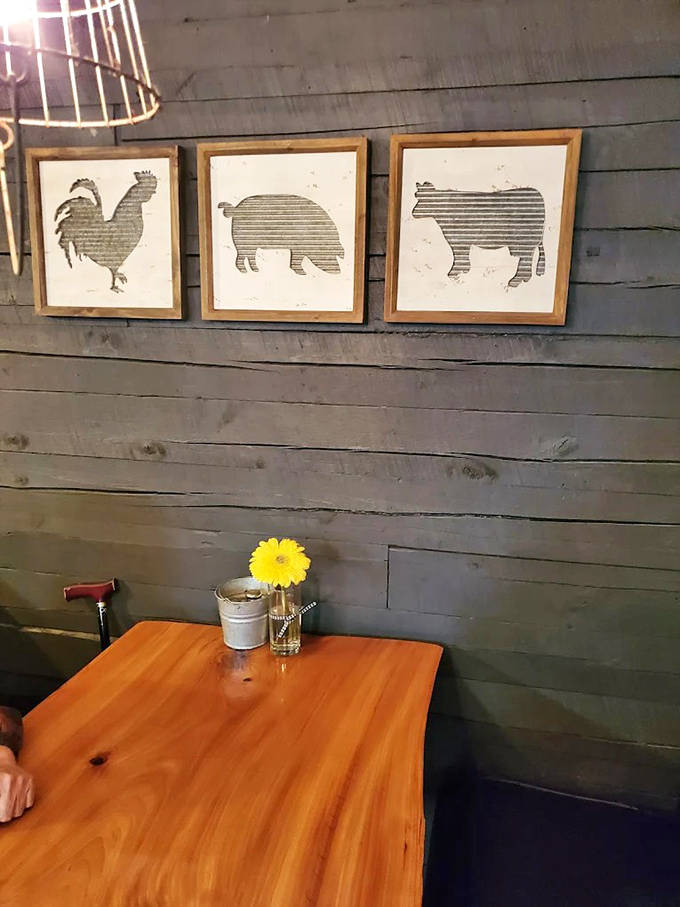 Simple farm-inspired artwork reminds you of the holy trinity of barbecue &ndash; chicken, pork, and beef &ndash; displayed with rustic elegance.