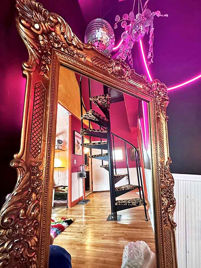 This isn't just a mirror &ndash; it's a portal to wonderland, reflecting spiral staircases and maximalist dreams in a frame ornate enough for royalty.