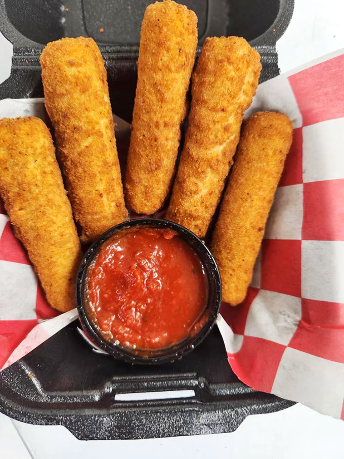 Golden-brown mozzarella sticks with marinara sauce &ndash; the perfect shareable snack that keeps your energy up for "just one more game."