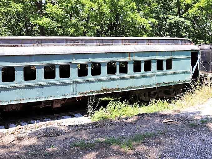 Even in retirement, this vintage passenger car maintains its dignity, its weathered blue exterior telling stories of countless journeys across America.