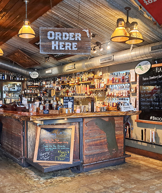 The bar isn't just where orders happen – it's command central for orchestrating the symphony of Southern flavors that keeps locals coming back.