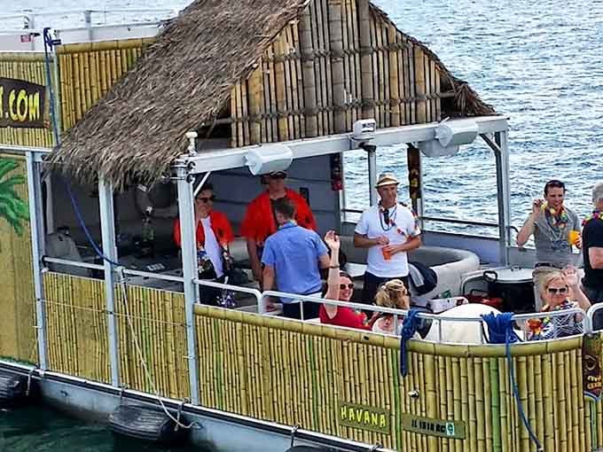 Passengers enjoy the open-air experience as the Island Party Boat navigates Chicago's waterways with tropical ease.