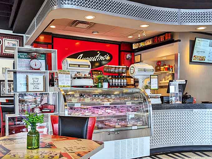 The register area showcases the deli case, where fresh ingredients wait to become your next favorite sandwich or salad.