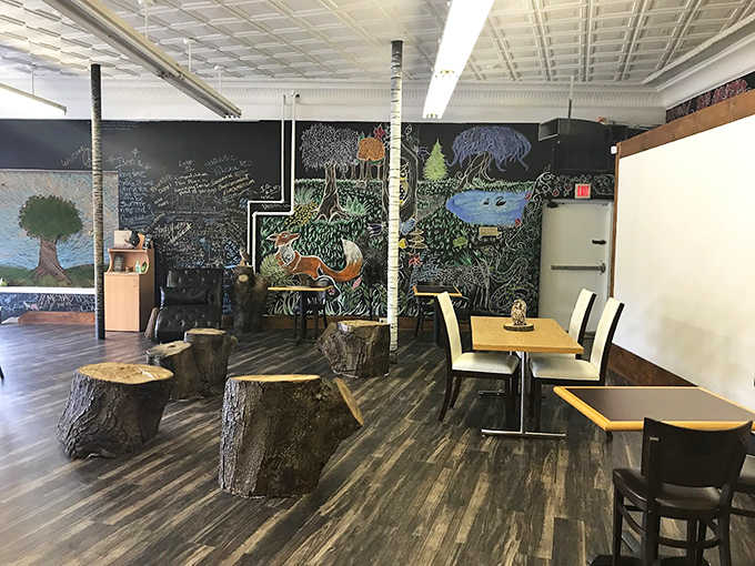 Tree stump seating and chalkboard murals transform dining into an enchanted forest experience, making everyday breakfast feel like a storybook adventure.