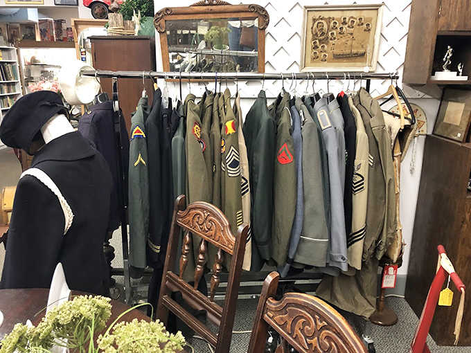 Military uniforms stand at attention, each button and insignia telling silent stories of service, sacrifice, and the people who once wore them.