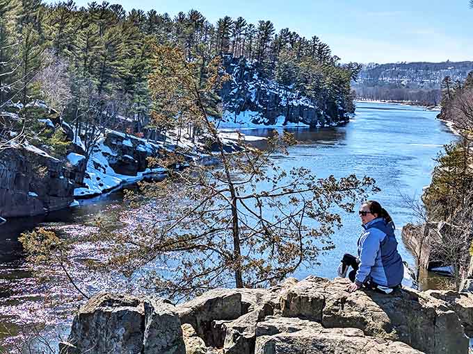 Winter transforms the St. Croix River into a blue ribbon winding through snow-dusted cliffs, creating vistas that make even non-photographers reach for cameras.