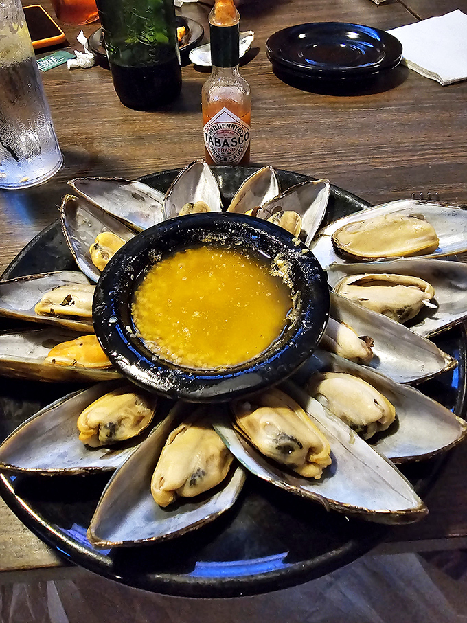 Steamed mussels: These plump, briny treasures arranged like a sunburst around melted butter prove Whitey's excellence extends well beyond burgers and into unexpected seafood territory.
