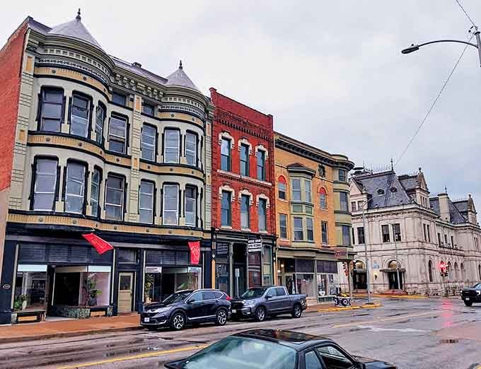 This street view captures Quincy's perfectly preserved historic streetscape, where buildings from different eras create a harmonious architectural conversation.