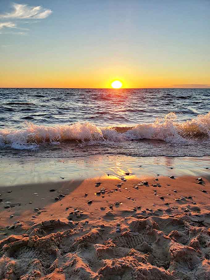 A Lake Michigan sunset paints the sky in impossible colors, turning an already beautiful beach into something truly magical.