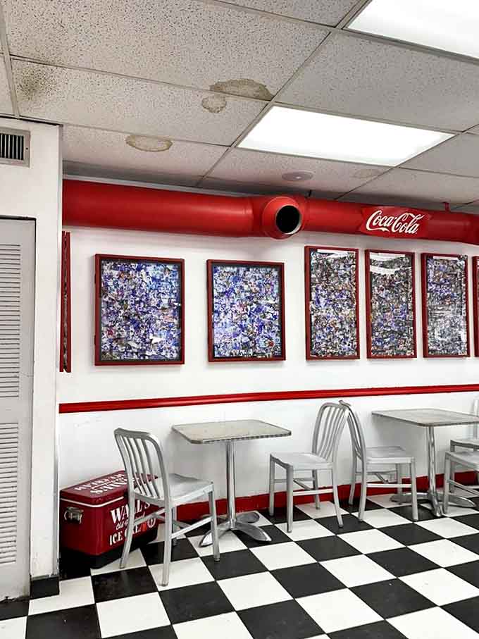 The dining area features classic Coca-Cola memorabilia and those unmistakable silver chairs that have supported ice cream enthusiasts for generations.