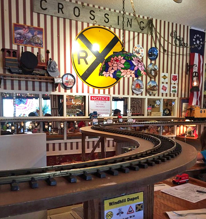 Railroad crossing signs and vintage memorabilia create an immersive experience where train enthusiasts and food lovers find common ground.