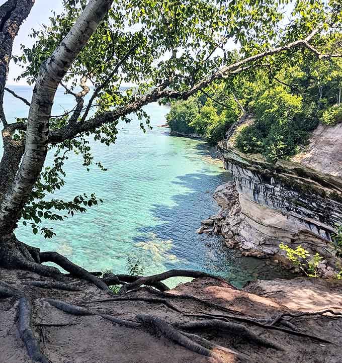 The view from the clifftop reveals the full drama of where fresh water meets the greatest of the Great Lakes in spectacular fashion.
