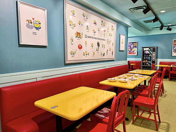 Blue walls adorned with Minion artwork create a playful backdrop for the red booths and yellow tables &ndash; dining inside a cartoon never felt so comfortable.