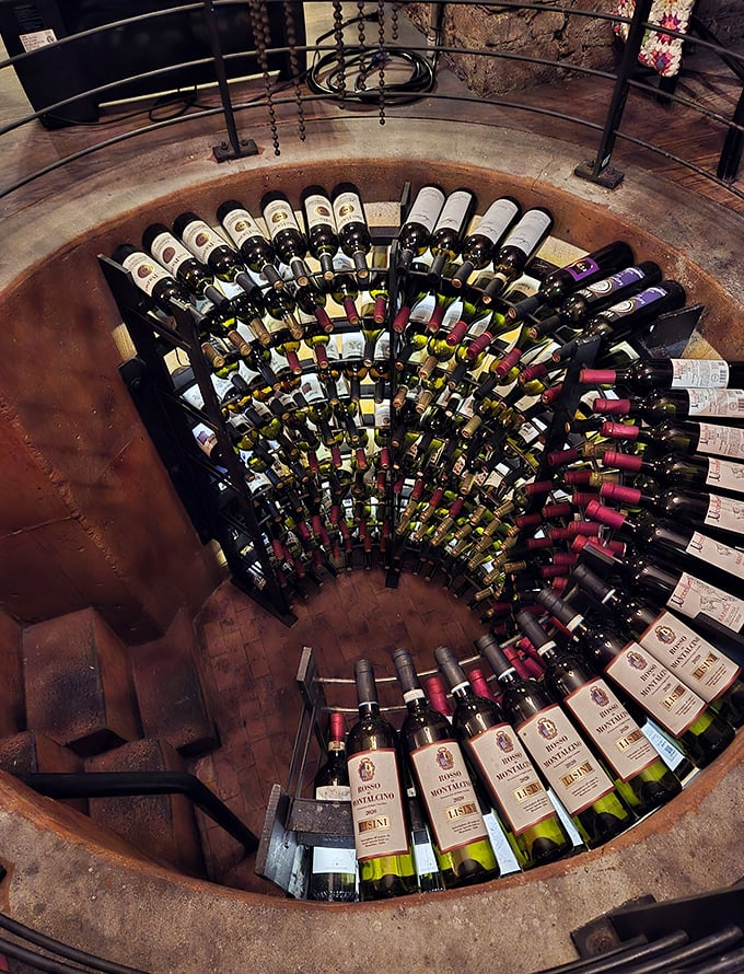 Sotto's wine cellar spirals like a liquid library, each bottle promising stories from Italian vineyards just waiting to be uncorked and shared.