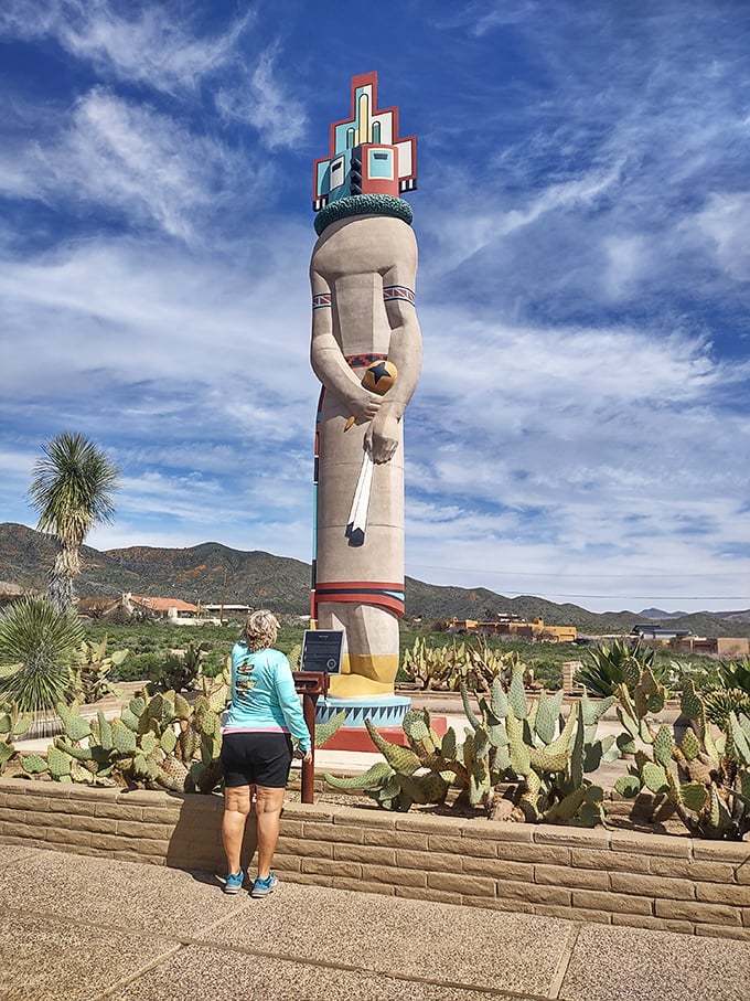 Viewed from below, the statue's impressive height becomes apparent against the vast Arizona sky.