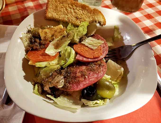 Even the salad gets the star treatment &ndash; a colorful antipasto arrangement that's practically doing a little Italian dance on the plate.