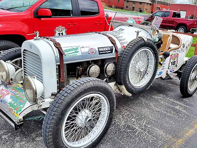 The 1916 Hudson Super Six represents automotive elegance from a bygone era, its wire wheels and brass fittings gleaming with historical significance.