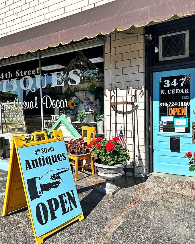 The cheerful turquoise door and bright yellow sign welcome visitors to this unassuming treasure trove, where vintage garden tools and planters spill onto the sidewalk.