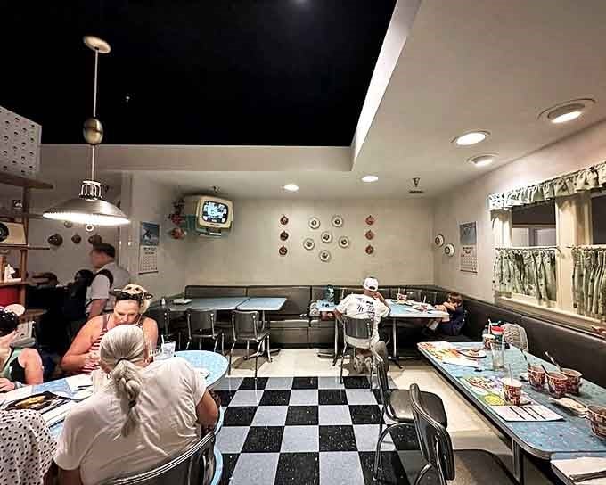 The dining area's chrome and vinyl transport you straight to a 1950s kitchen, where conversation flows as freely as the gravy.