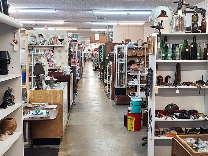 The Logan Antique Mall sign welcomes visitors with simple charm, giving no hint of the wonderland of memories waiting just beyond its doors.