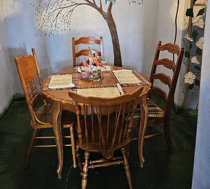A quiet corner table beneath hand-painted murals offers the perfect spot for intimate conversations and lingering over that second cup of coffee.