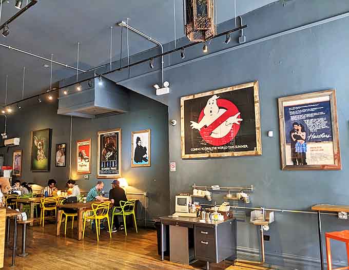 Movie posters from '80s classics line the walls, creating the perfect backdrop for enjoying your carefully crafted beverage.