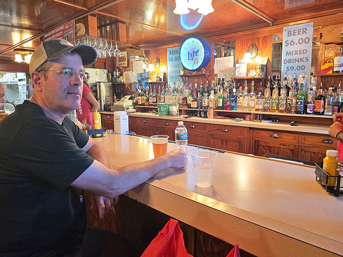 The well-stocked bar invites conversation and camaraderie, where locals and visitors alike find common ground.