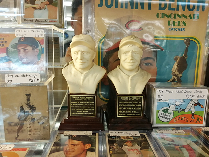 Baseball Memorabilia: These stoic busts of baseball legends silently judge your knowledge of America's pastime while vintage cards document the sport's golden era.