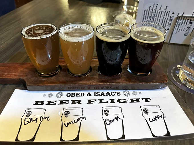 A pilgrimage through brewing traditions arrives on wooden paddles – liquid enlightenment in four perfectly poured glasses awaiting your devotion.