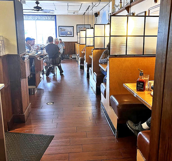 Lush plants and natural light create an urban oasis where coffee sipping and pancake savoring become meditative morning rituals.