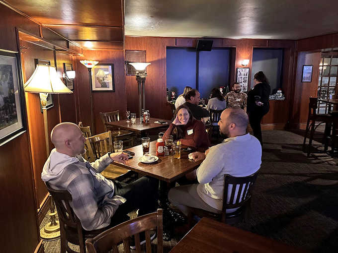 Conversations flow as freely as the beer in the pub's intimate dining area, where wood-paneled walls create a cocoon of British comfort.