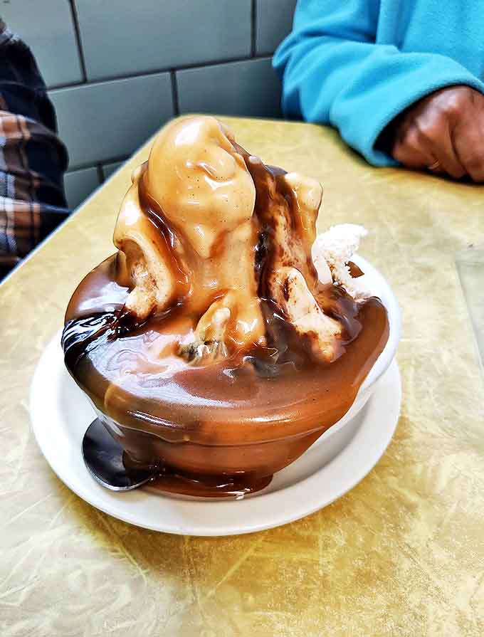 Caramel so smooth it could talk its way out of a traffic ticket, embracing ice cream in a warm, buttery hug.