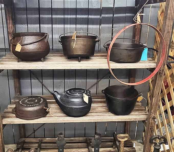 Cast iron cookware seasoned by generations of use, these pieces still cook better than most modern pans money can buy.