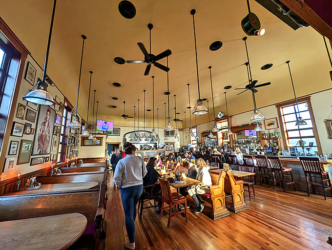 High ceilings and pendant lighting create a space that feels both intimate and grand, honoring the building's architectural heritage.