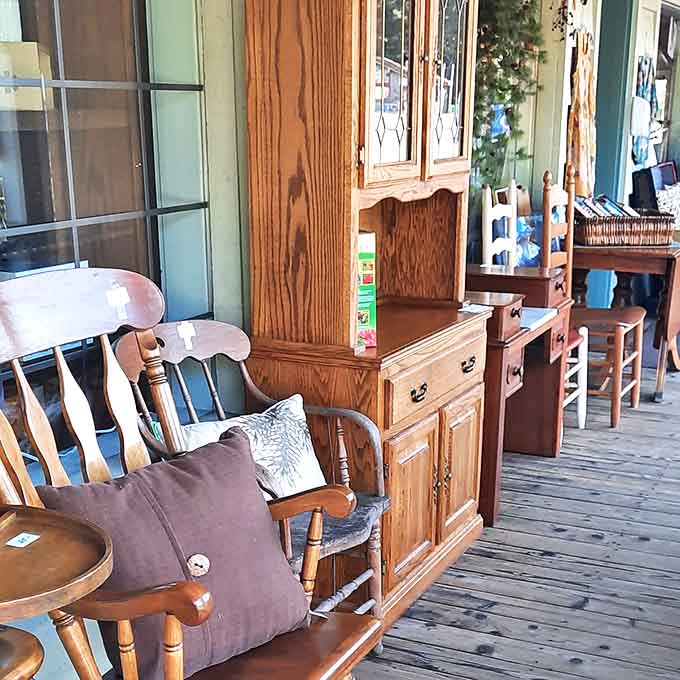 Wooden furniture with stories to tell creates an inviting porch display &ndash; each piece practically whispering "take me home" to passing shoppers.