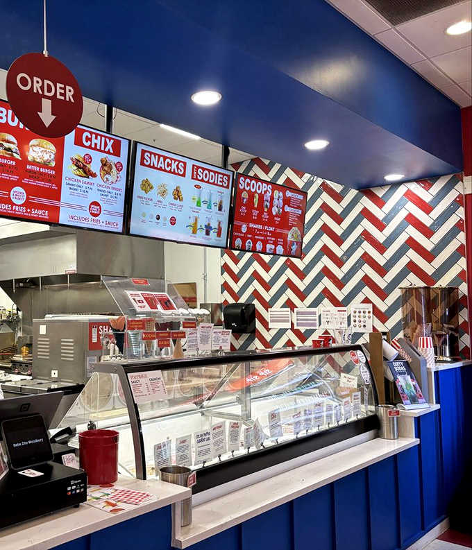 Behind this counter, ice cream scientists conduct delicious experiments daily. The red and blue color scheme feels patriotic &ndash; as if serving great ice cream is civic duty.