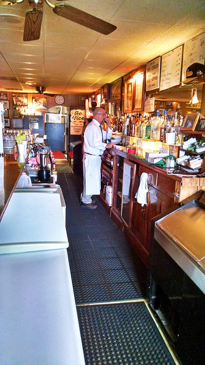 Behind this well-worn bar, generations of bartenders have mixed drinks, shared stories, and created the soundtrack for countless celebrations.