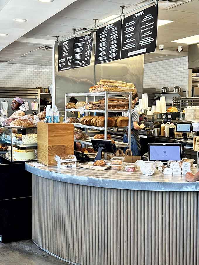 That curved counter holds more baked goods than your willpower can handle, and honestly, that's perfectly fine with everyone involved.
