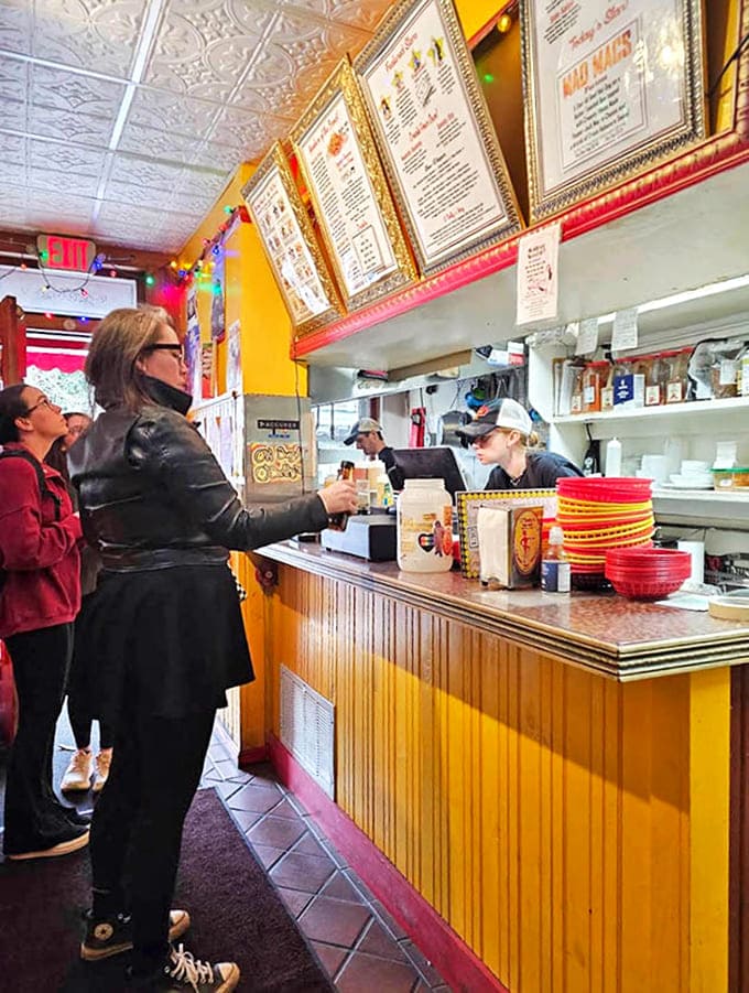Ordering at O'Betty's is like approaching the altar of hot dog worship, with menus displayed like sacred texts above the counter.