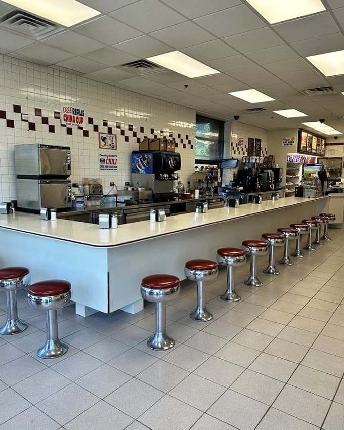 The long counter with its row of stools invites you to sit, stay awhile, and watch the world go by between bites.
