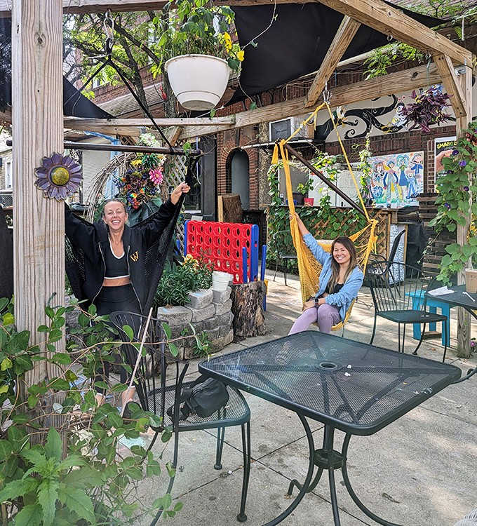 The outdoor patio invites playful moments between bites, proving that the best dining experiences engage more than just your taste buds.