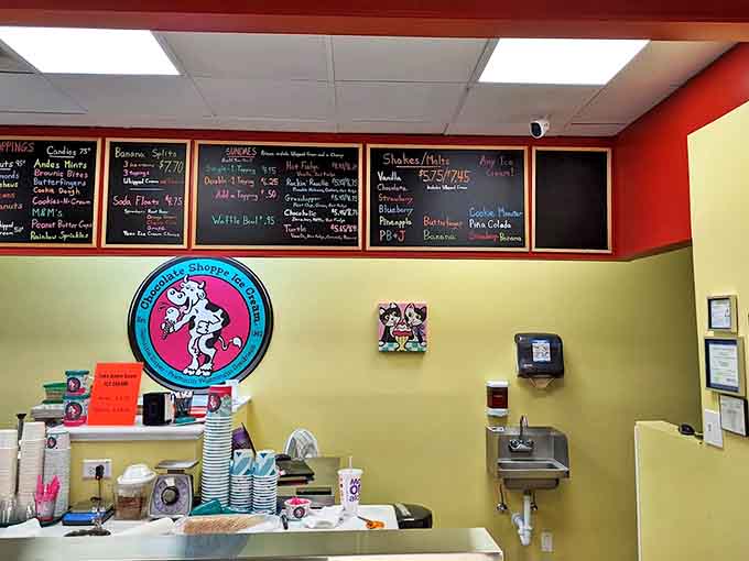 Chalkboard menus showcase daily specials in colorful handwriting, while the iconic cow logo reminds visitors they've found the real deal.