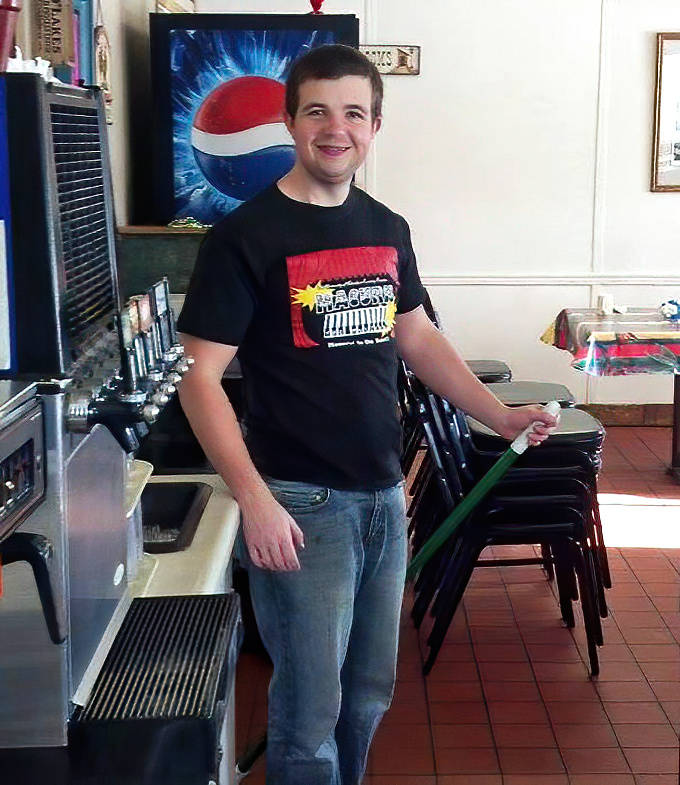 A friendly face in the dining room represents the heart of small-town hospitality &ndash; where service isn't just a job, it's a community calling.