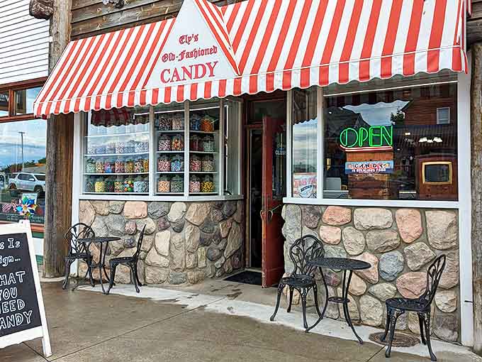 The striped awning of Ely's Old-Fashioned Candy Store signals sweet nostalgia inside, where treats from your childhood await rediscovery.