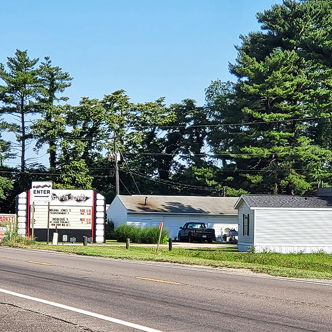 Daylight reveals the drive-in's entrance sign, promising nightly double features and memories that outlast the final credits.